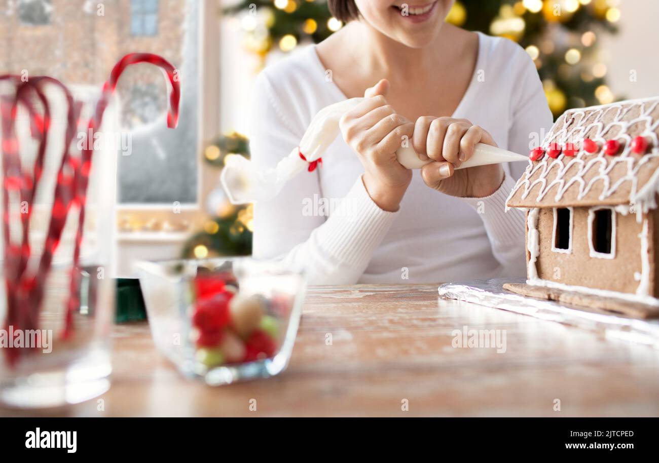 Woman glazing traditional gingerbread hi-res stock photography and ...