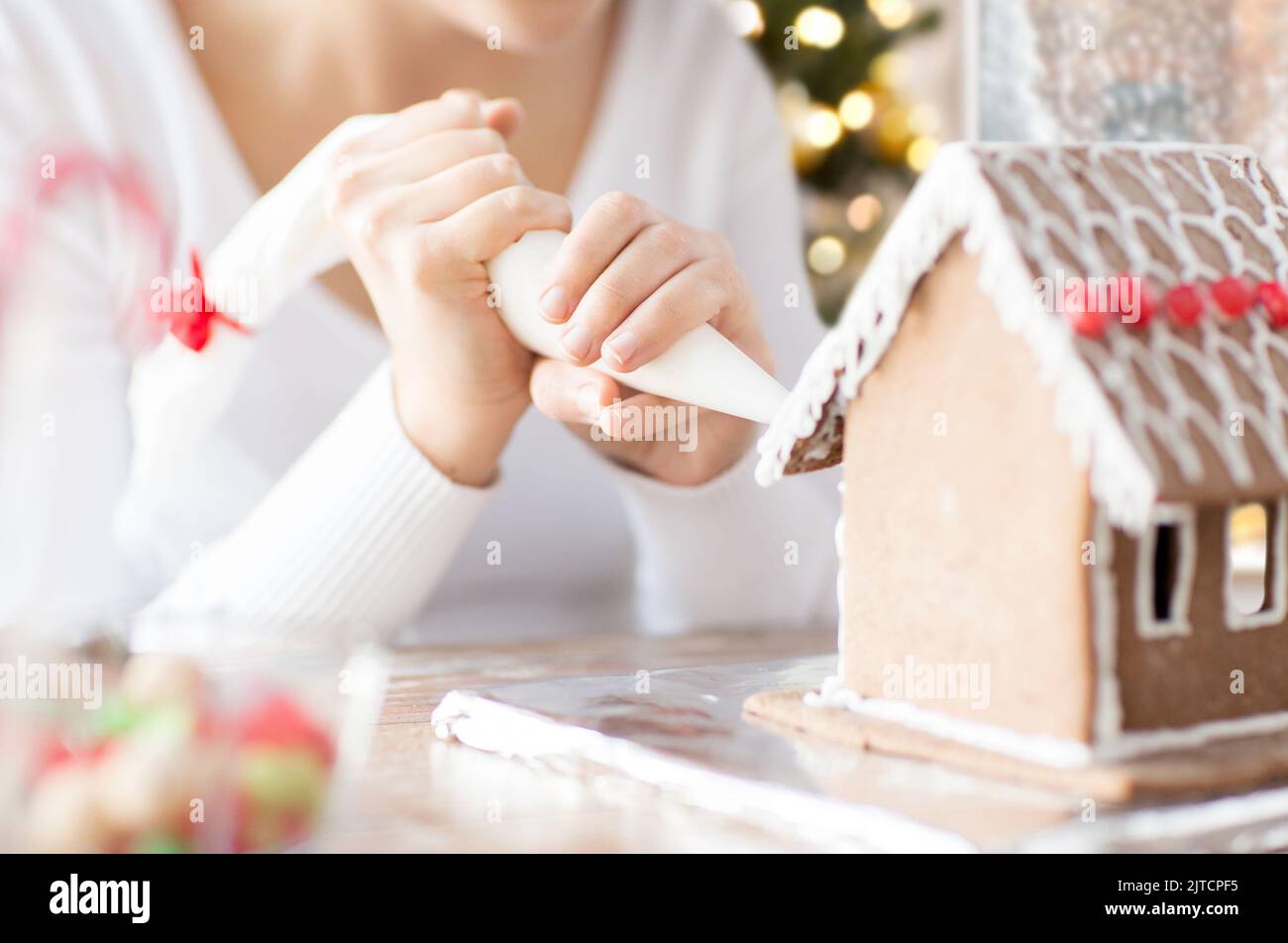 Woman glazing traditional gingerbread hi-res stock photography and ...