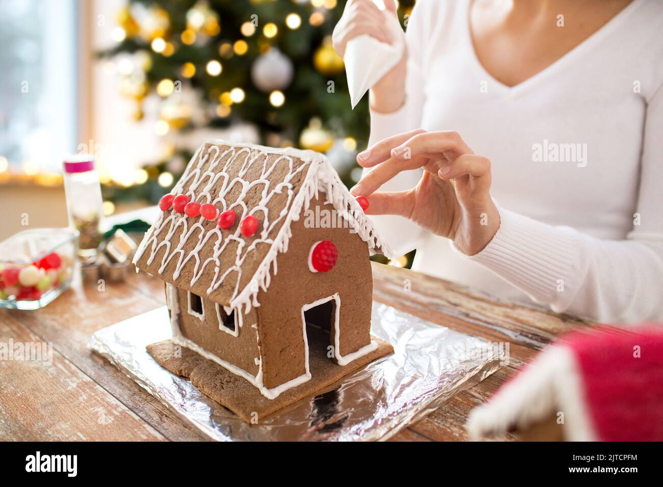 Woman glazing traditional gingerbread hi-res stock photography and ...
