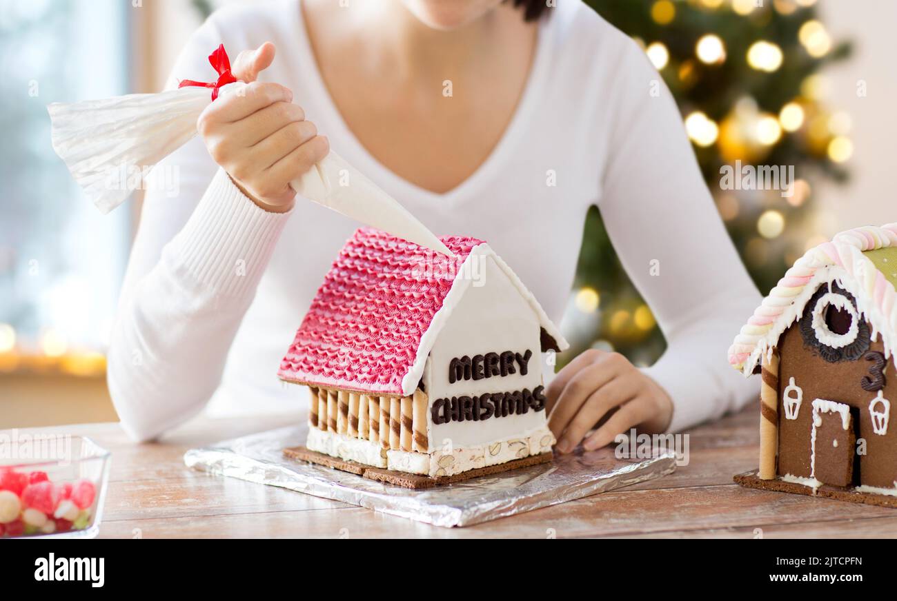 Woman glazing traditional gingerbread hi-res stock photography and ...