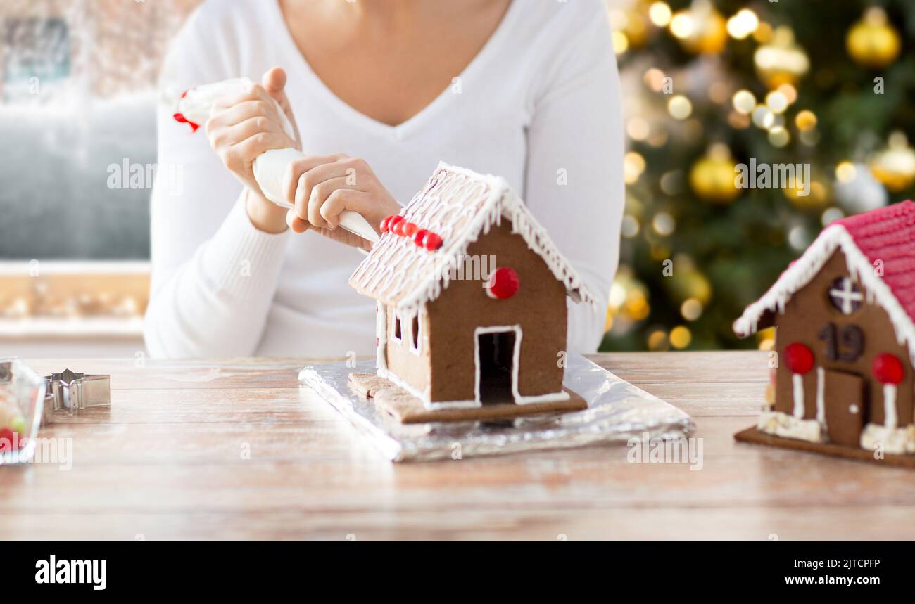 Woman glazing traditional gingerbread hi-res stock photography and ...