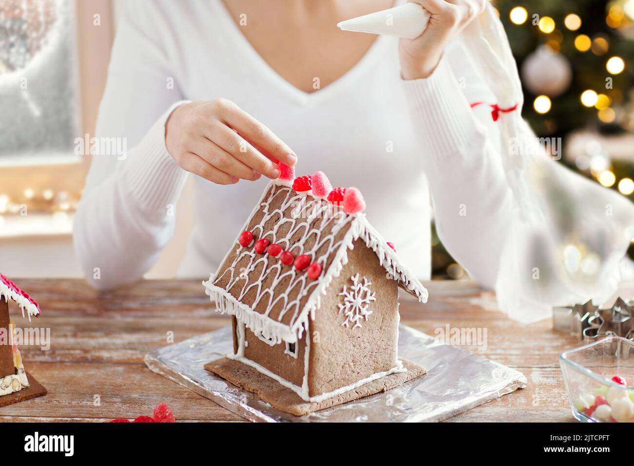 Woman glazing traditional gingerbread hi-res stock photography and ...