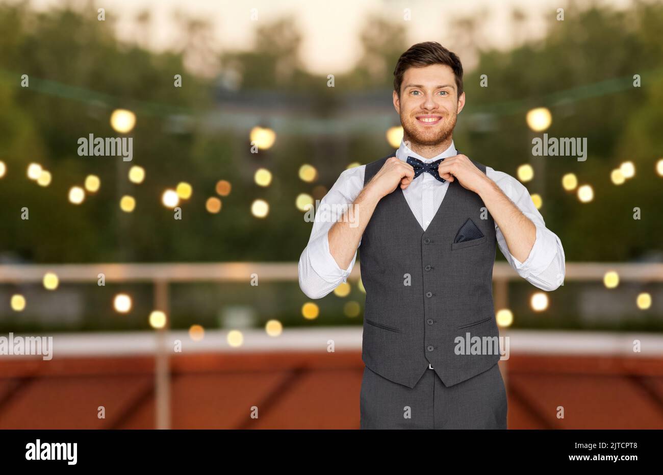 happy man in festive suit at rooftop party Stock Photo - Alamy