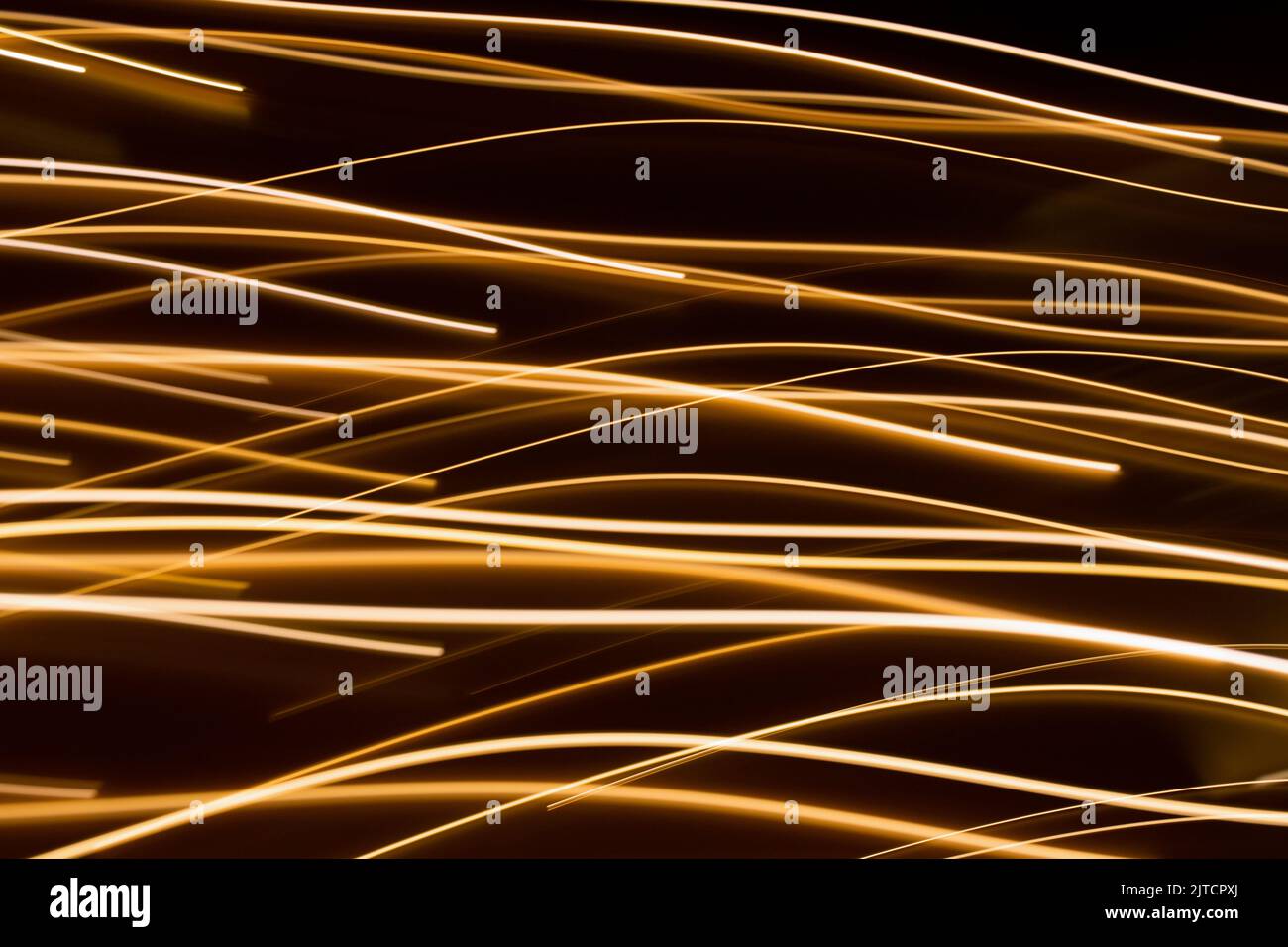 golden electric light effect on dark background Stock Photo - Alamy