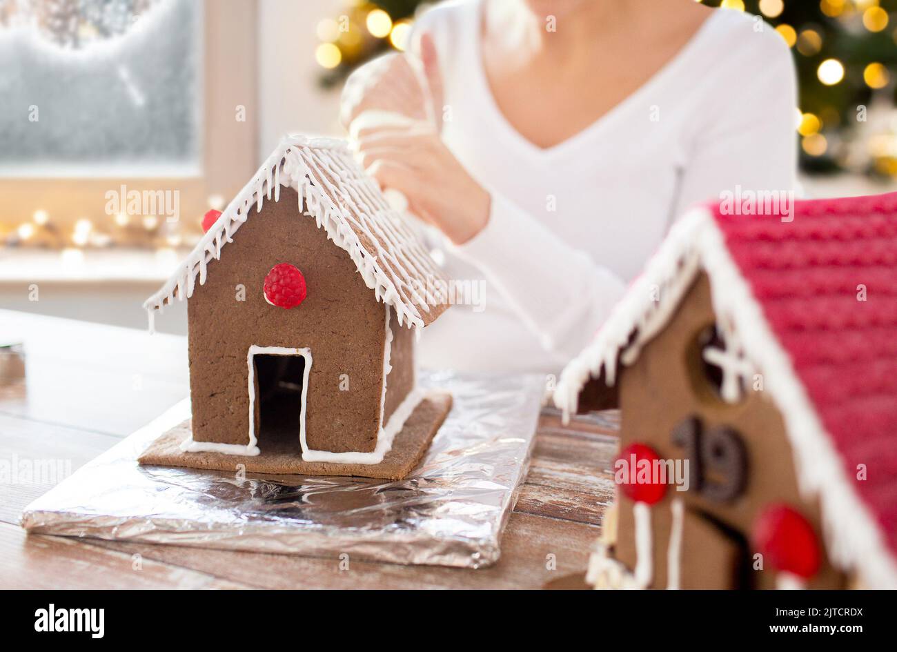 Woman glazing traditional gingerbread hi-res stock photography and ...