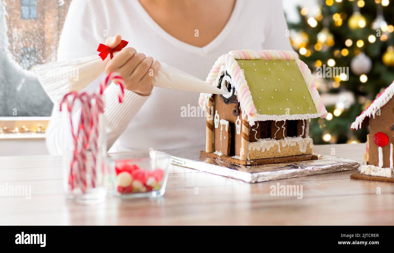 Woman glazing traditional gingerbread hi-res stock photography and ...
