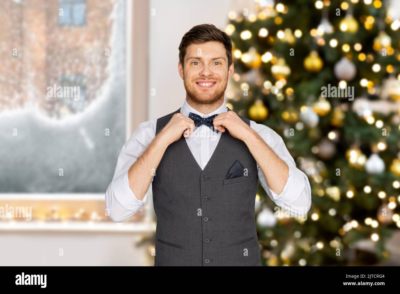 happy man in festive suit dressing for party Stock Photo - Alamy