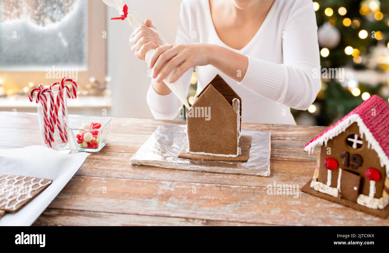 Woman glazing traditional gingerbread hi-res stock photography and ...