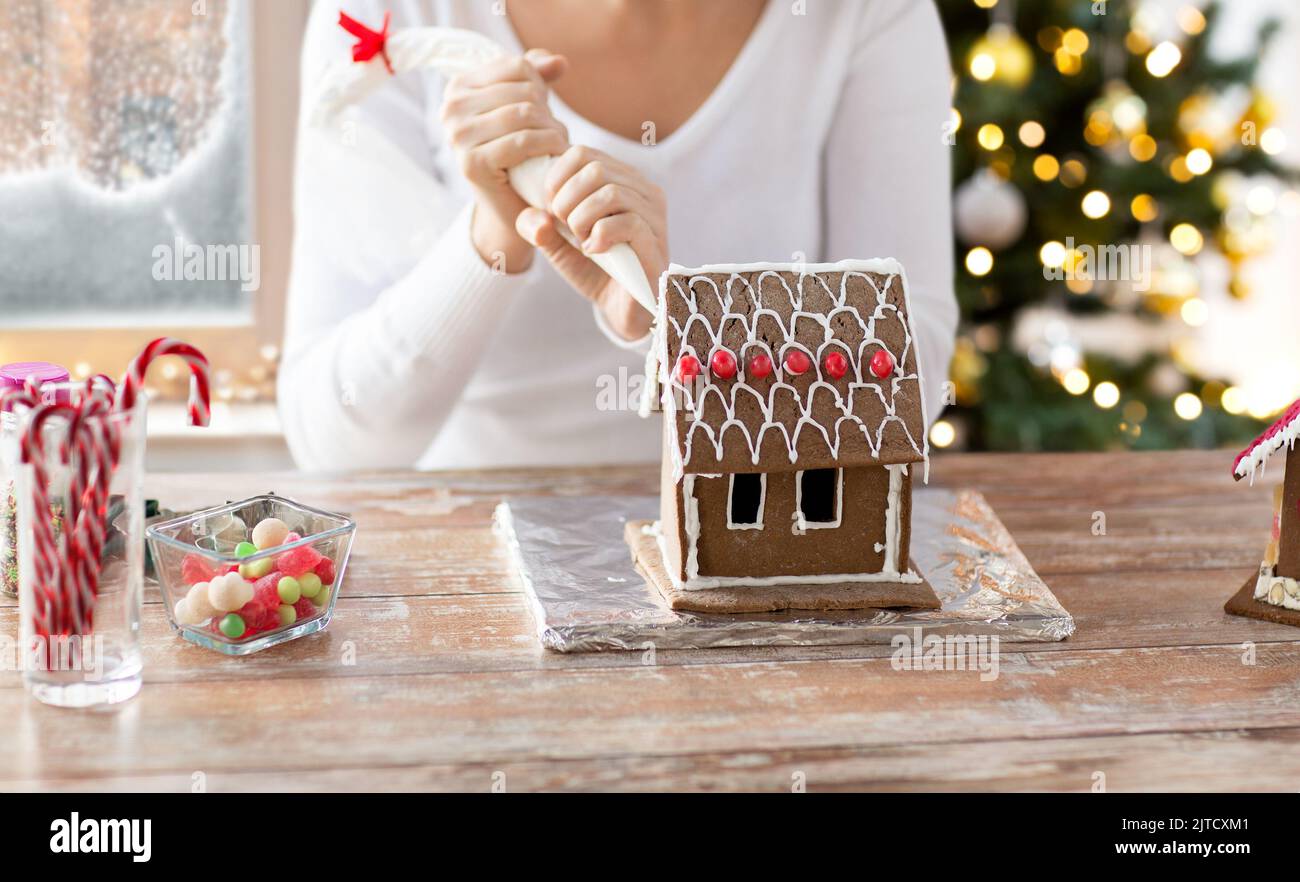 Woman glazing traditional gingerbread hi-res stock photography and ...