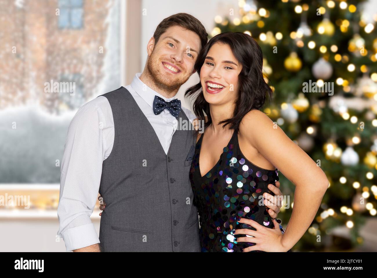 happy couple hugging at christmas party Stock Photo - Alamy