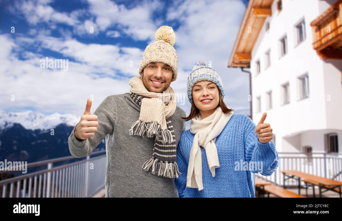 happy couple showing thumbs up in winter Stock Photo - Alamy