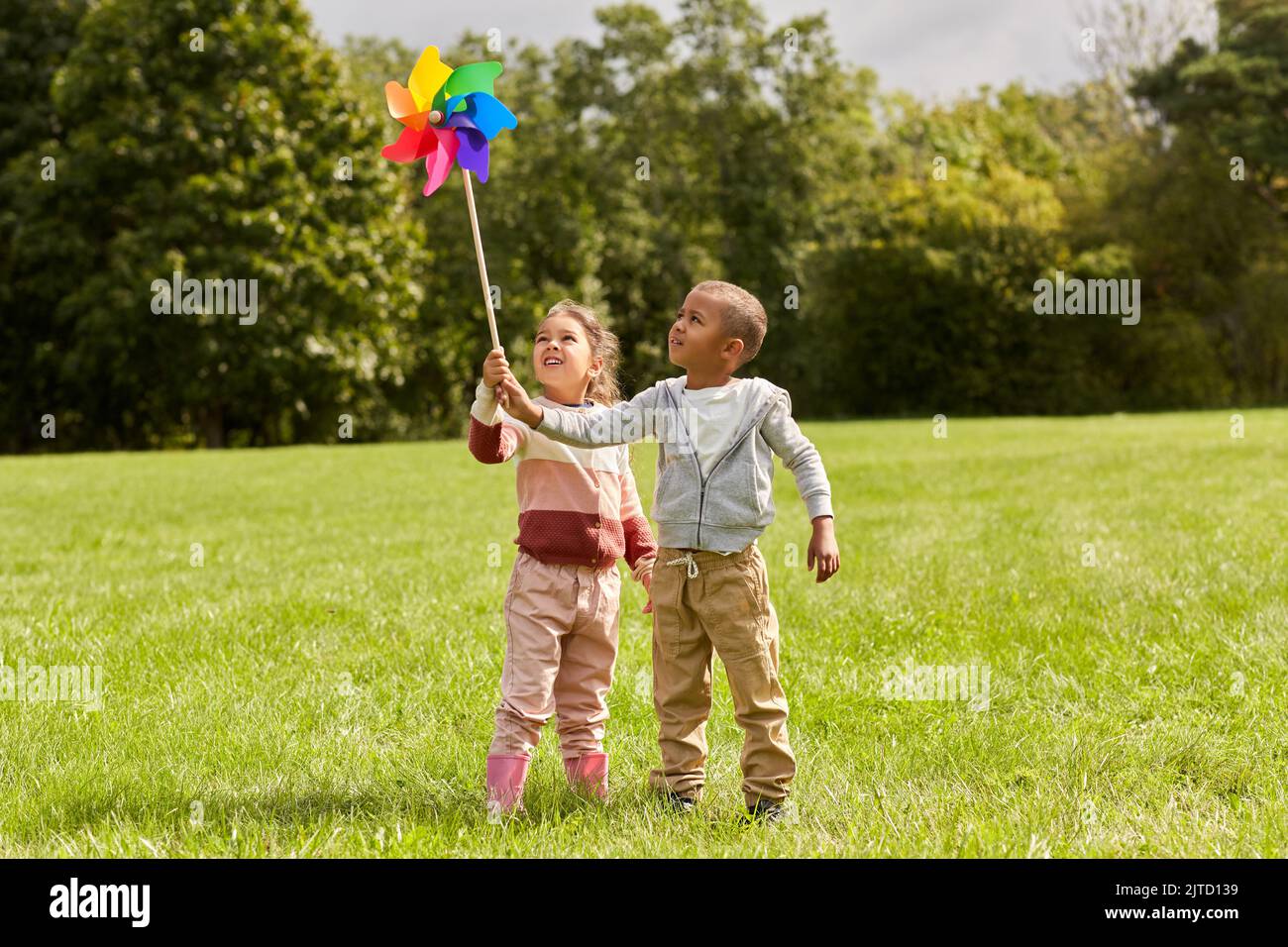 Kids playing windmill hi-res stock photography and images - Alamy