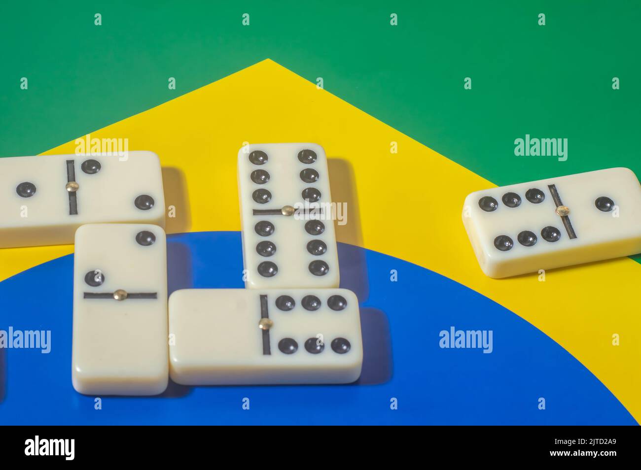 Domino game on top of a yellow and blue green flag,Brazilian colors ...