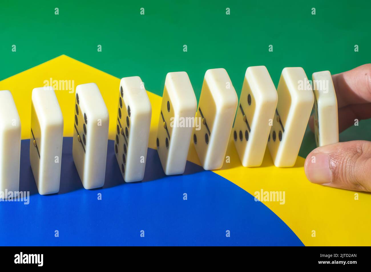 Domino game on top of a yellow and blue green flag,Brazilian colors ...