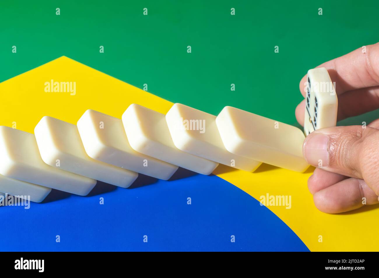 Domino game on top of a yellow and blue green flag,Brazilian colors ...