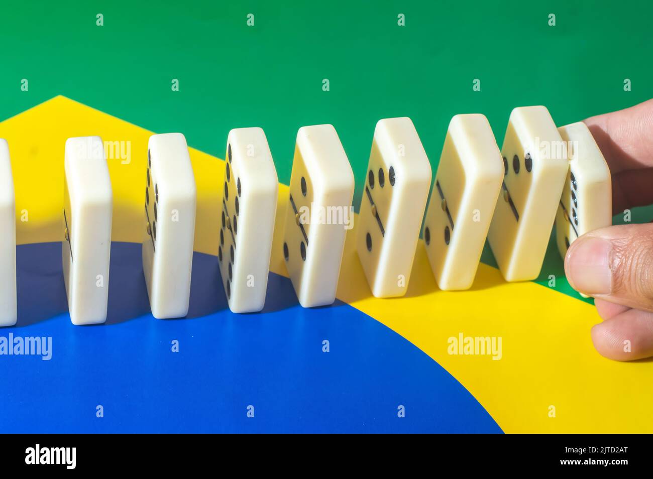 Domino game on top of a yellow and blue green flag,Brazilian colors ...