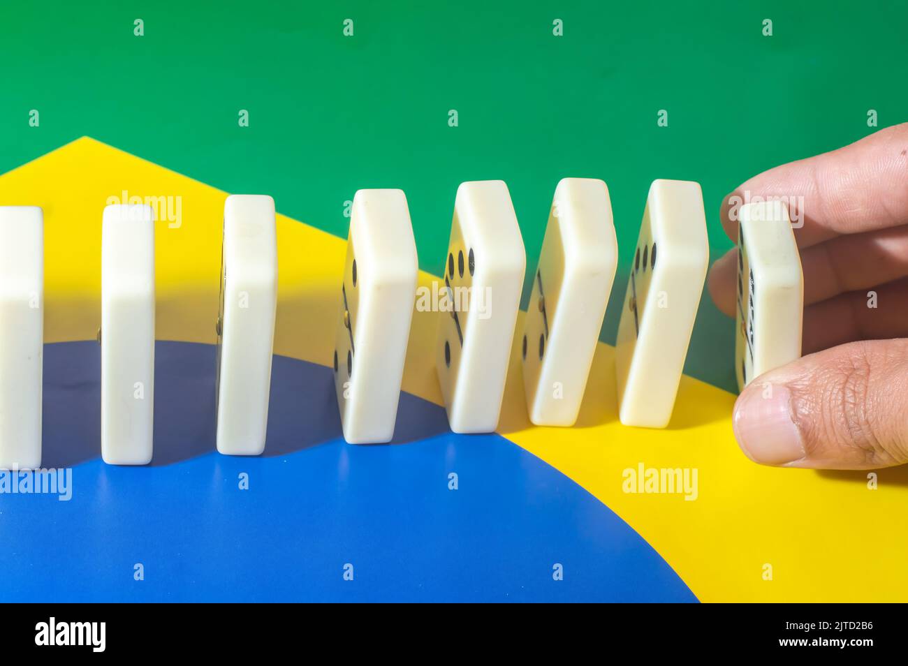 Domino game on top of a yellow and blue green flag,Brazilian colors ...
