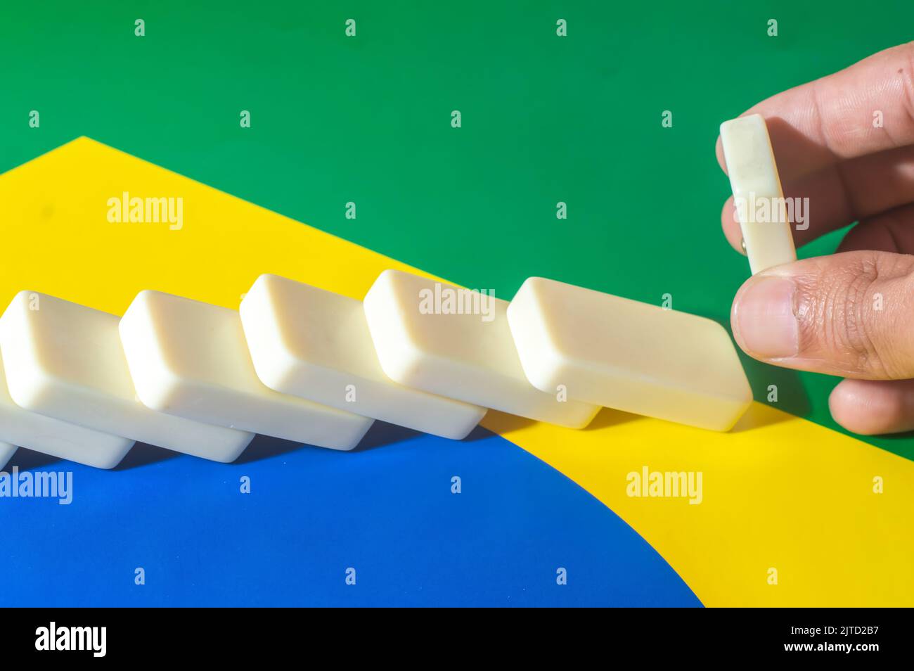 Domino game on top of a yellow and blue green flag,Brazilian colors ...