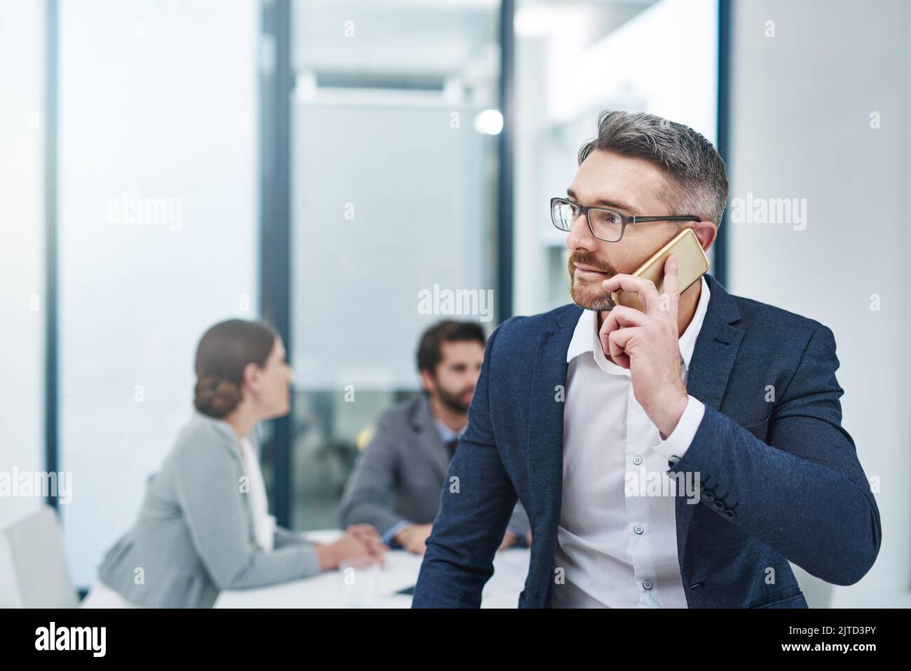 He couldnt miss this call...a handsome businessman taking a call during ...