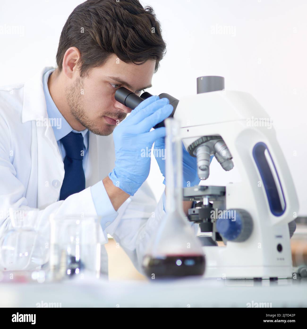 Identifying microorganisms that are causing infection. a young male ...