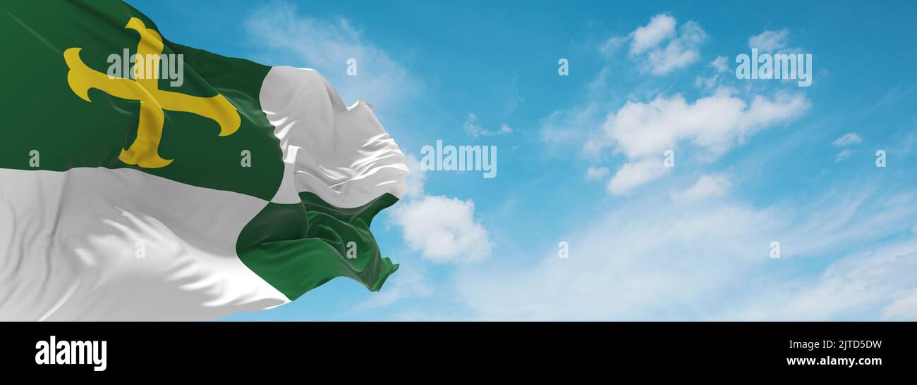 official flag of Comerio untied states of America at cloudy sky ...