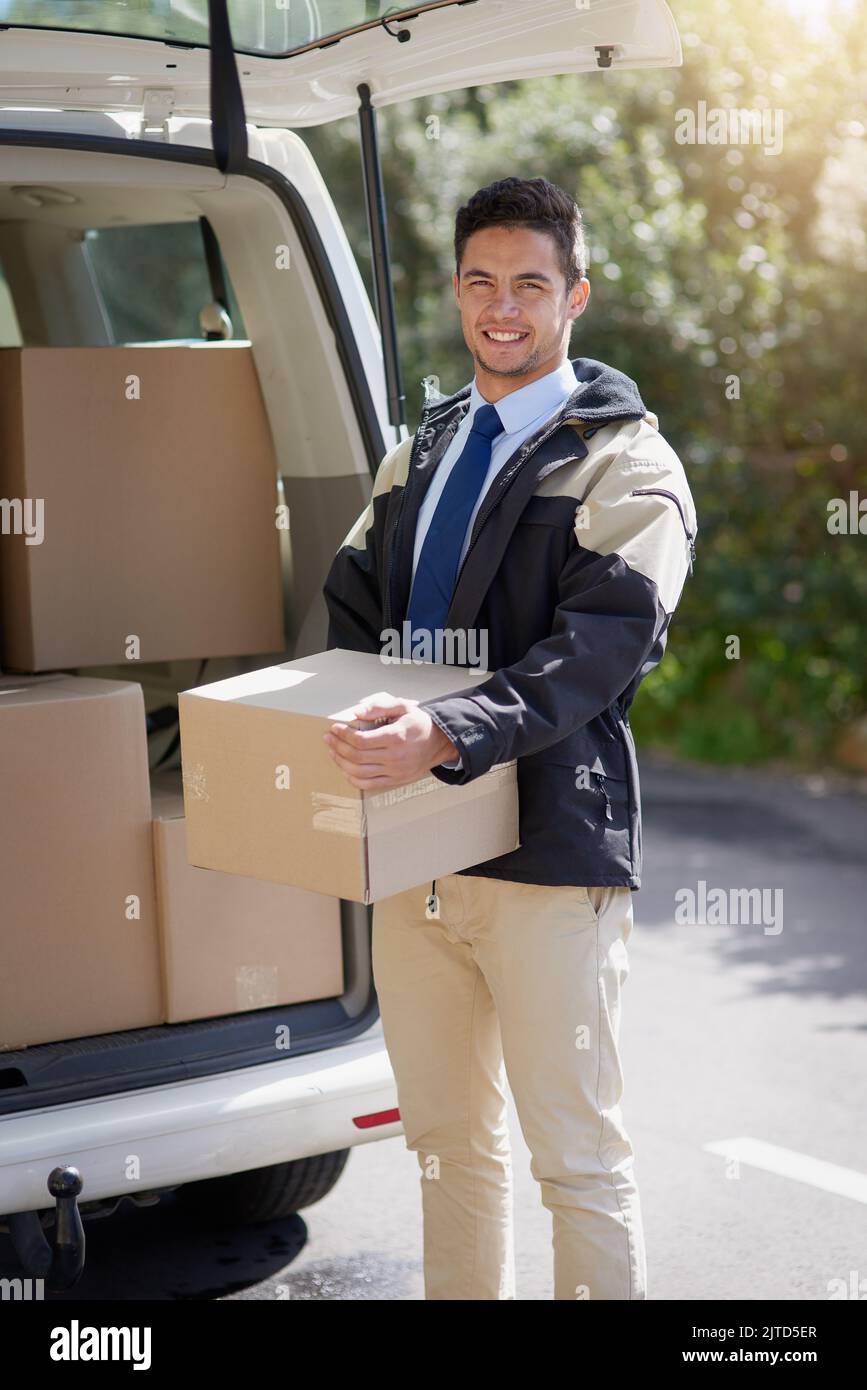 From our warehouse to your door. Portrait of a friendly delivery man ...