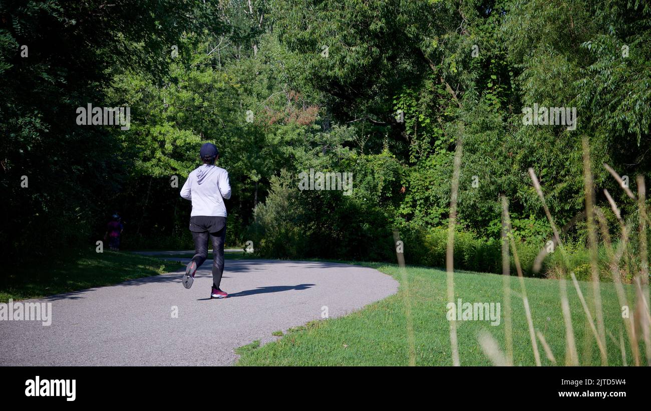 Toronto, Ontario / Canada - Aug 28, 2022: A single female jogging in ...