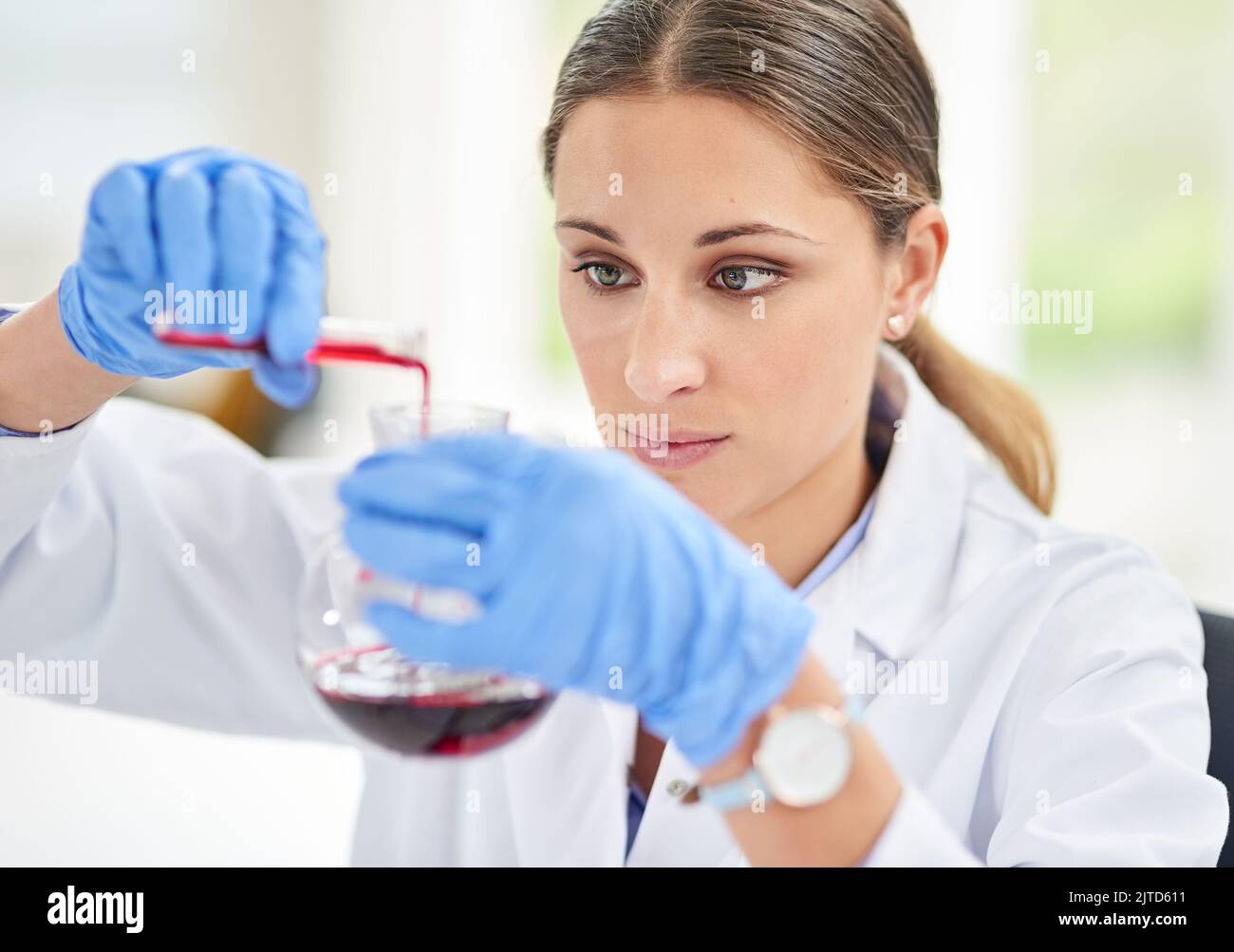 Conducting tests to build better insights. a young female scientist ...