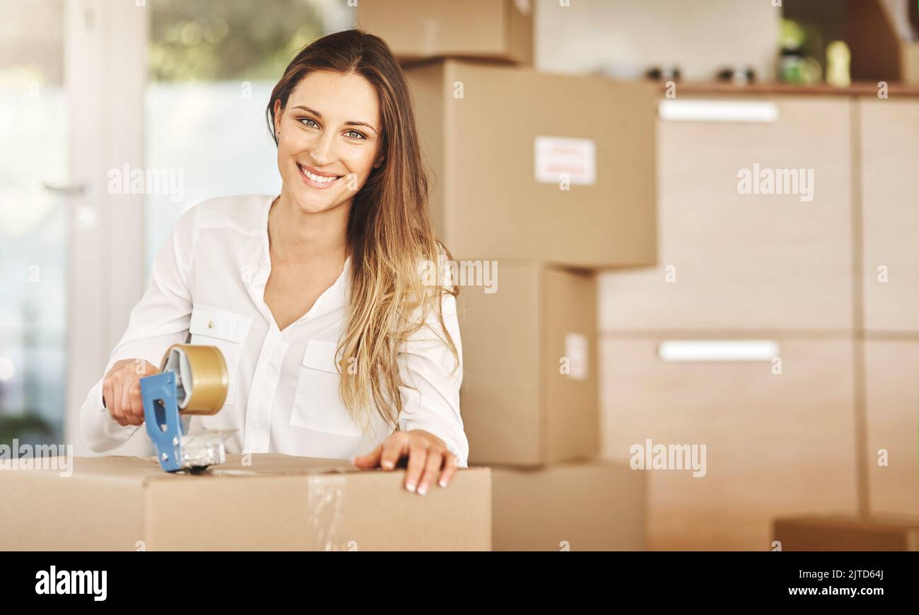 This box is heading for my new home. Cropped portrait of an attractive ...