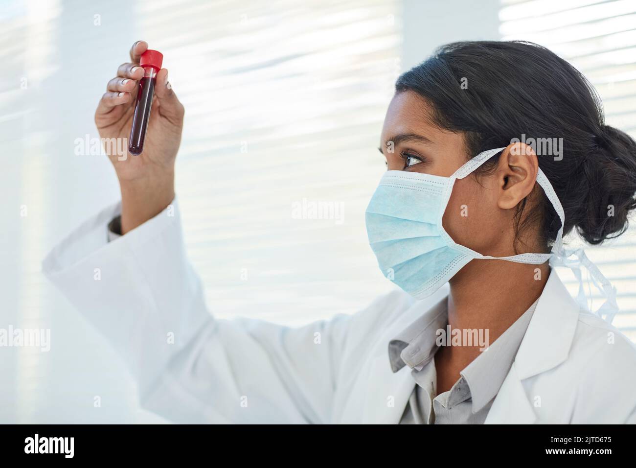 Ensuring her findings are as accurate as possible. a young female ...