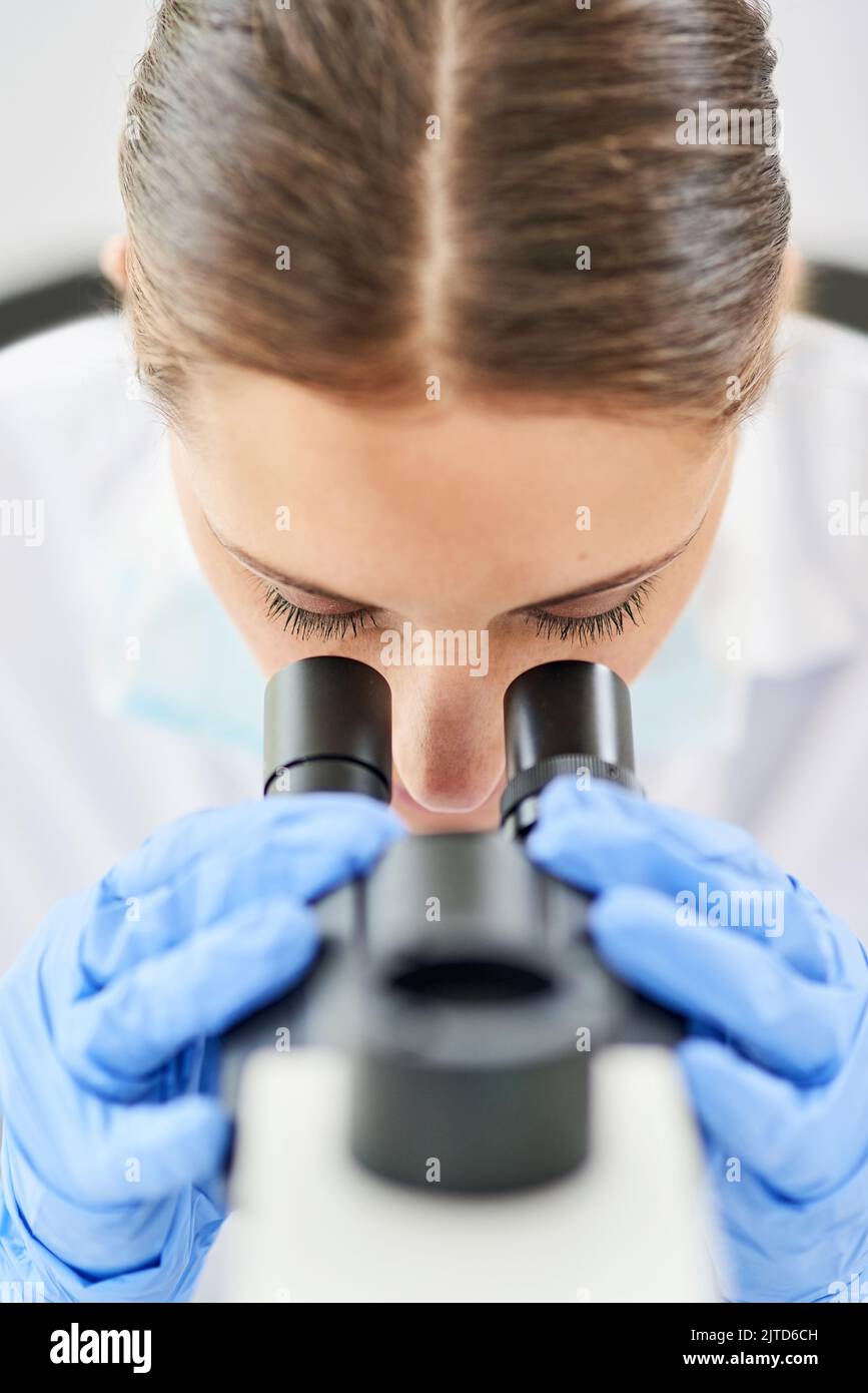 Making sense of the world through science. a young female scientist ...