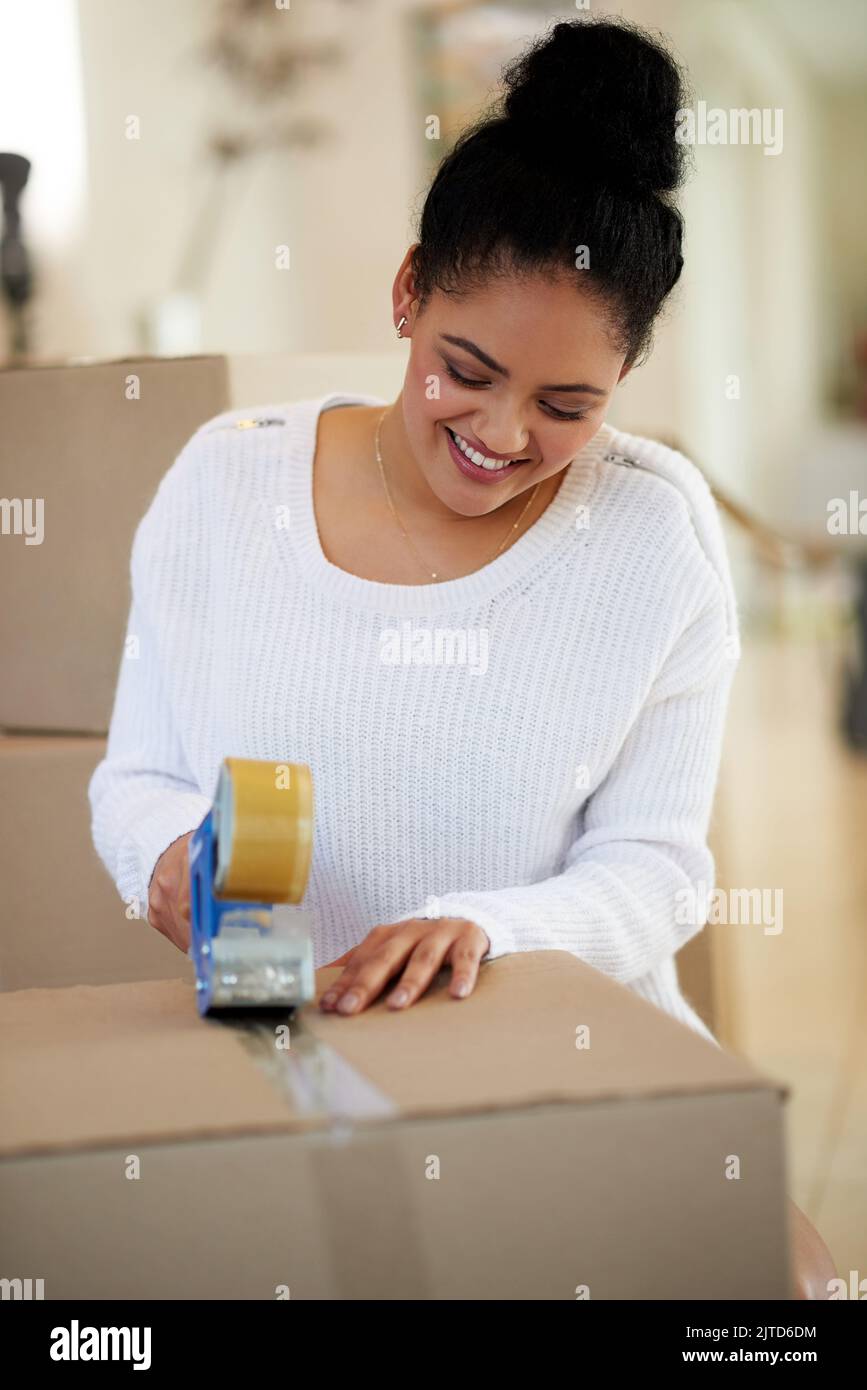 Moving is fun when you have the right tools. a happy young woman ...