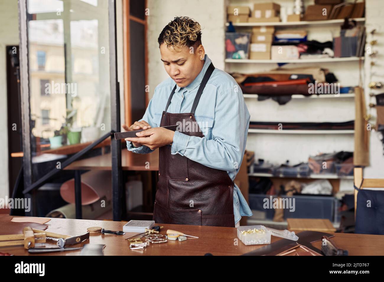 African woman working leather hi-res stock photography and images - Alamy