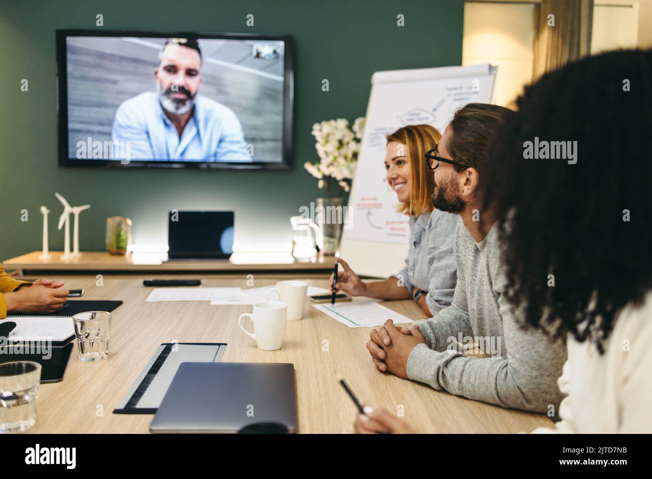 Modern business professionals having a video conference in a boardroom ...