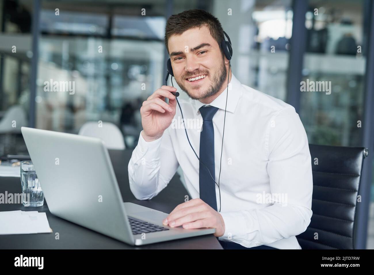 Here to offer support. Portrait of a young customer service ...