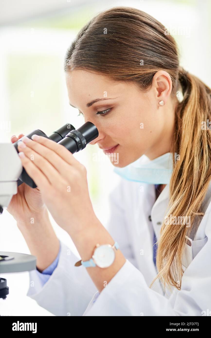 Exploring the world through science. a young female scientist working ...