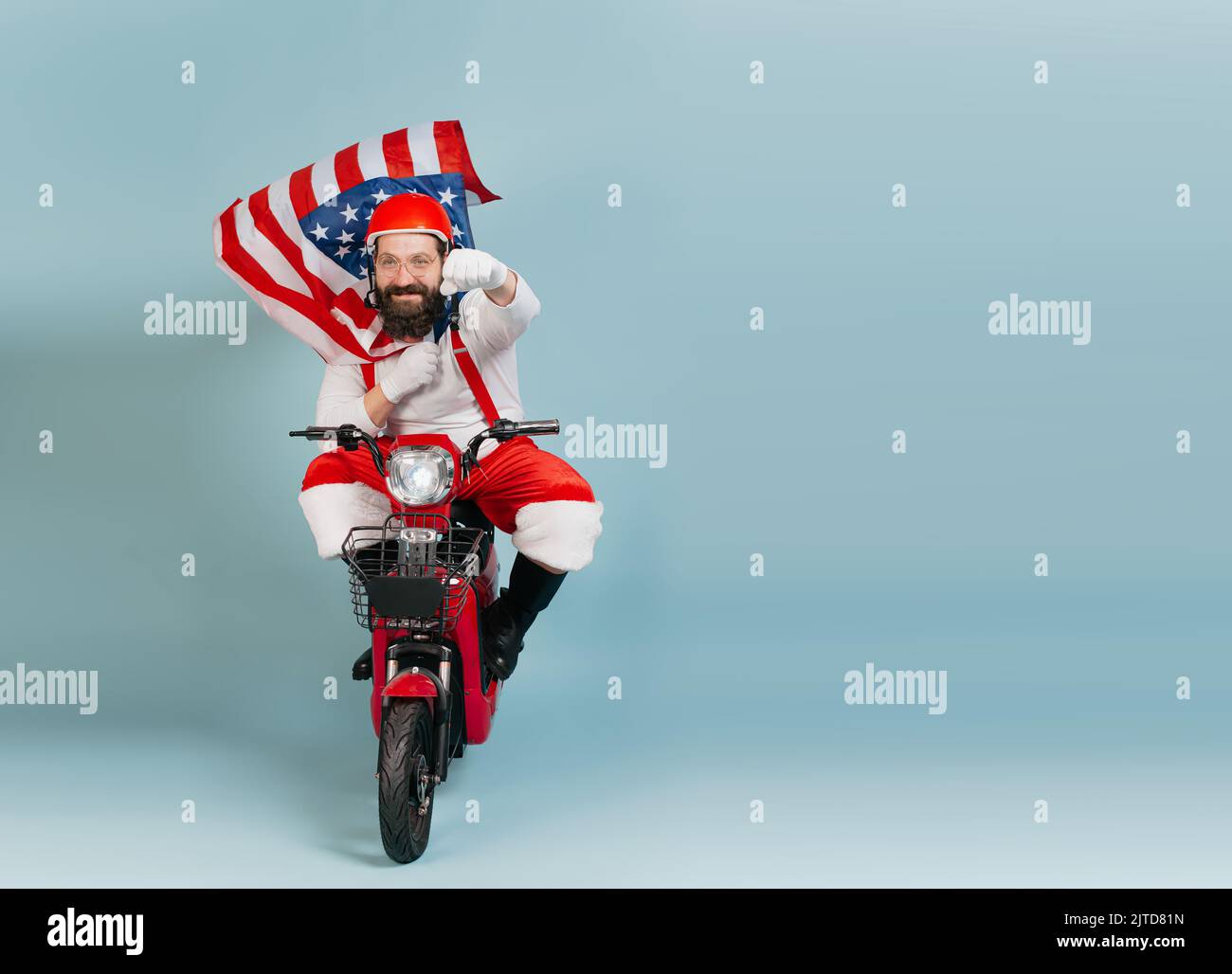 Santa in a superman pose with a fluttering usa flag in the form of a ...