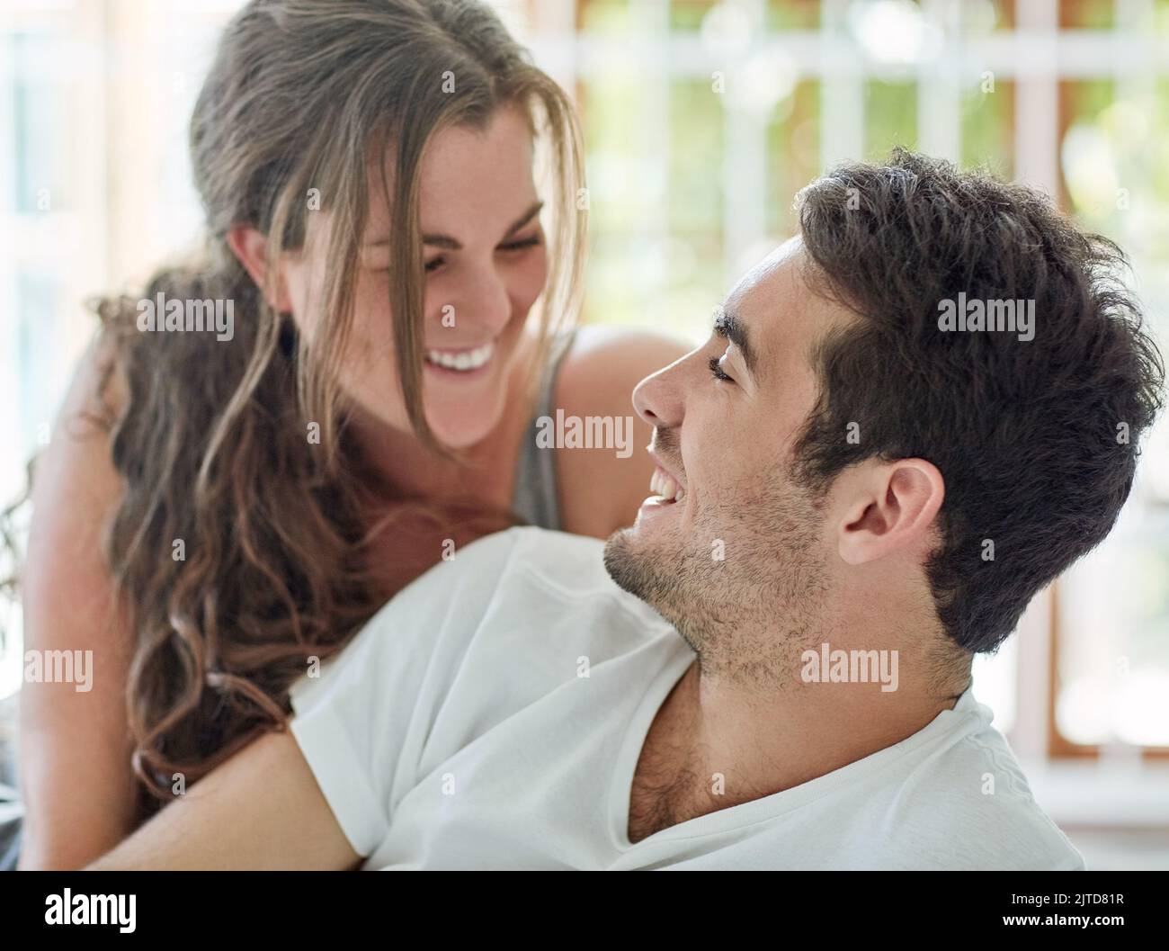 Why dont we have a weekend in, just us two. a young couple enjoying a relaxing morning together ...