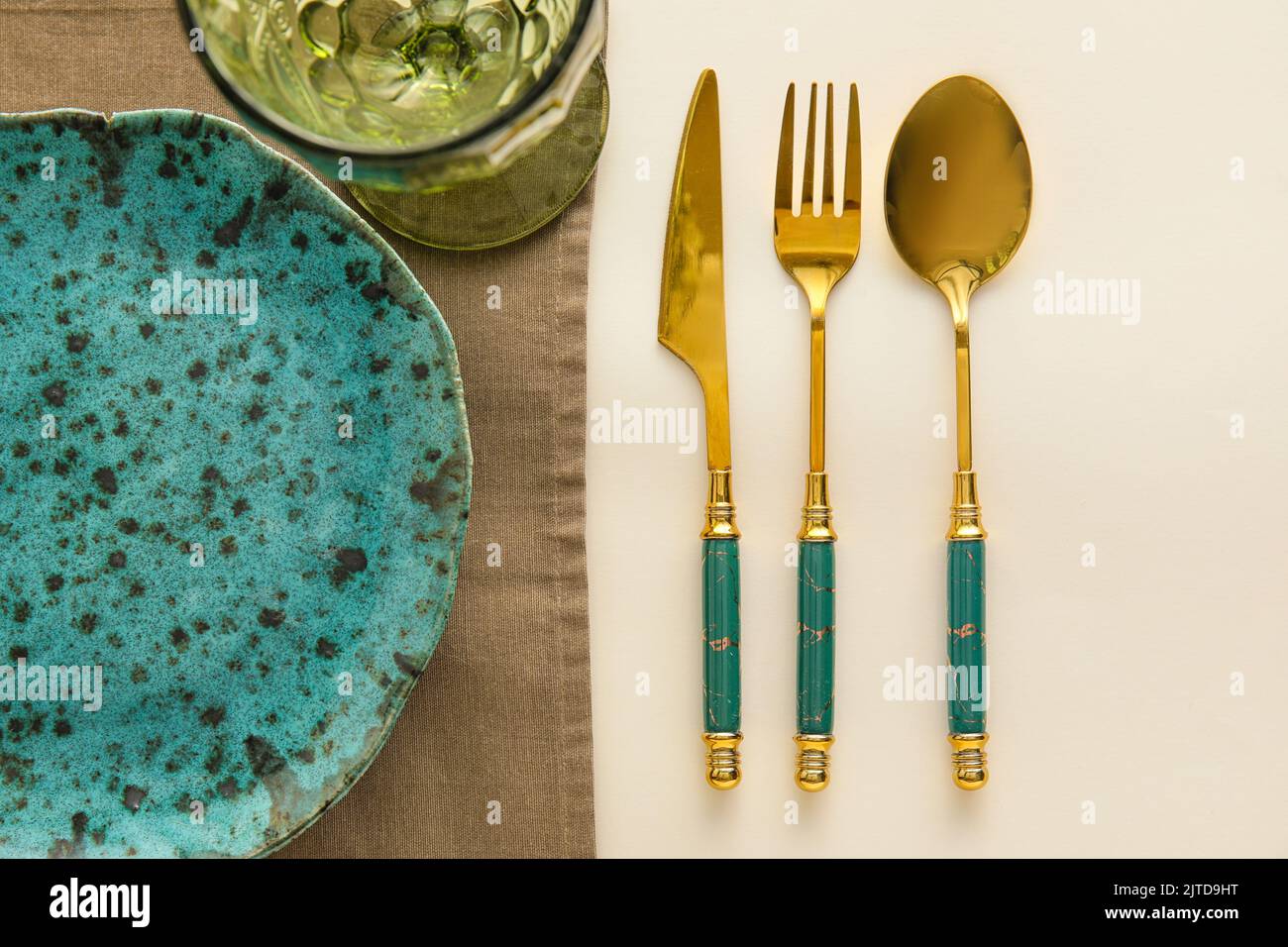 Trendy table setting on white background Stock Photo - Alamy