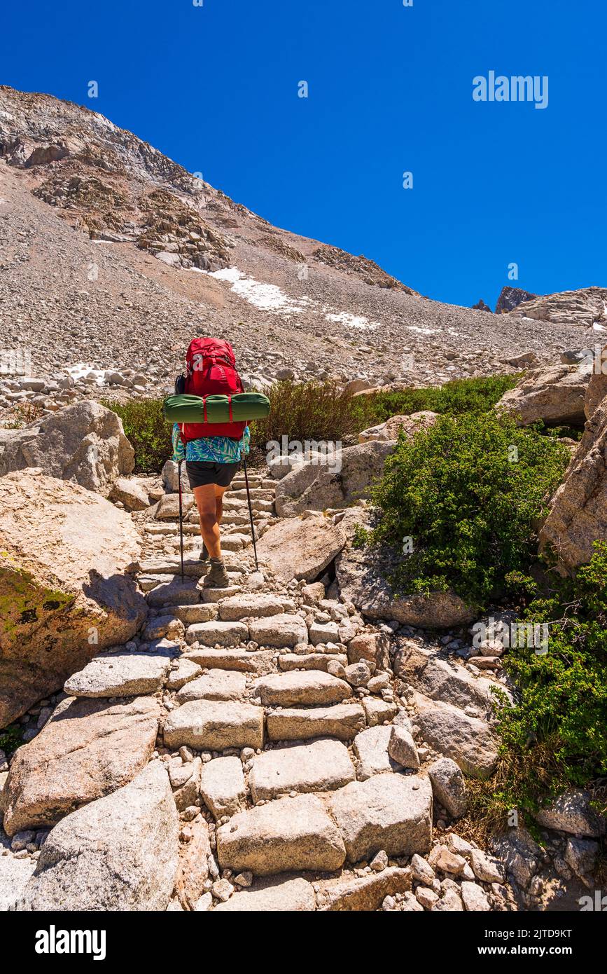 Hiker climbing stone stairs on the Mount Whitney Trail, John Muir ...