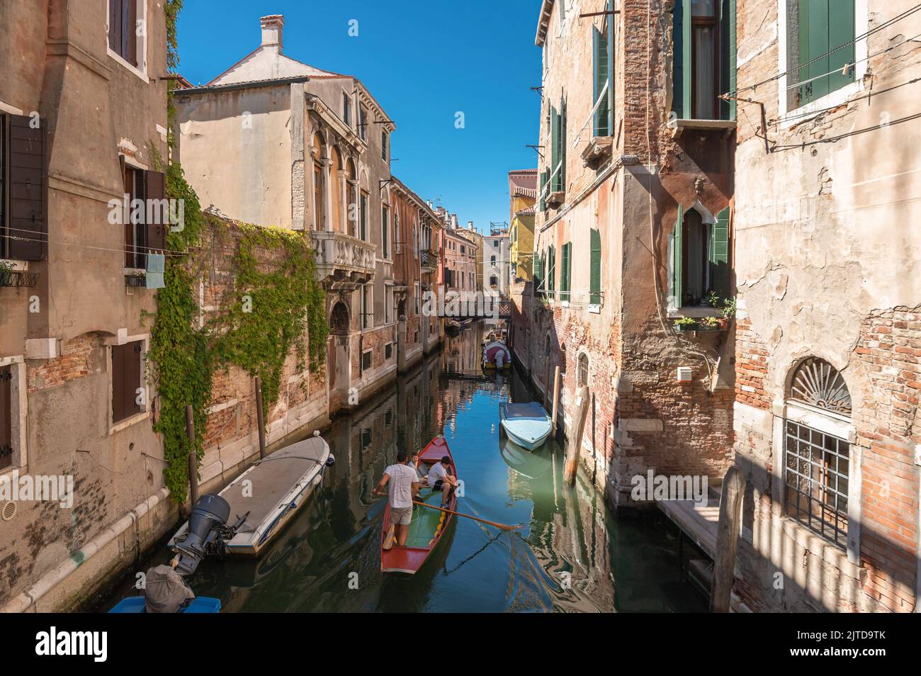 Permanent residents of Venice travel around the city by personal boat ...