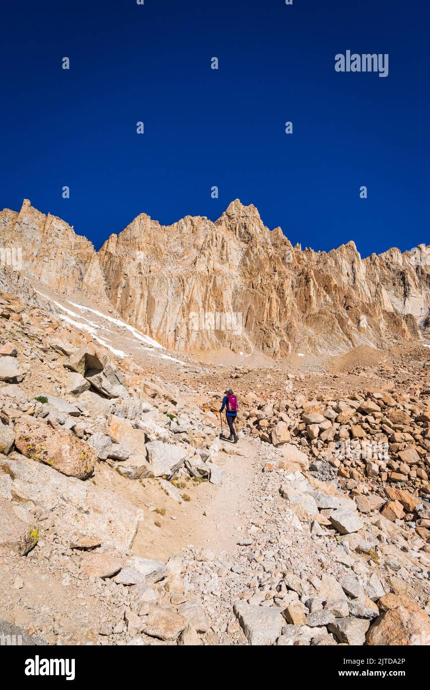 Hiker on the Mount Whitney Trail under Mount Muir, John Muir Wilderness ...
