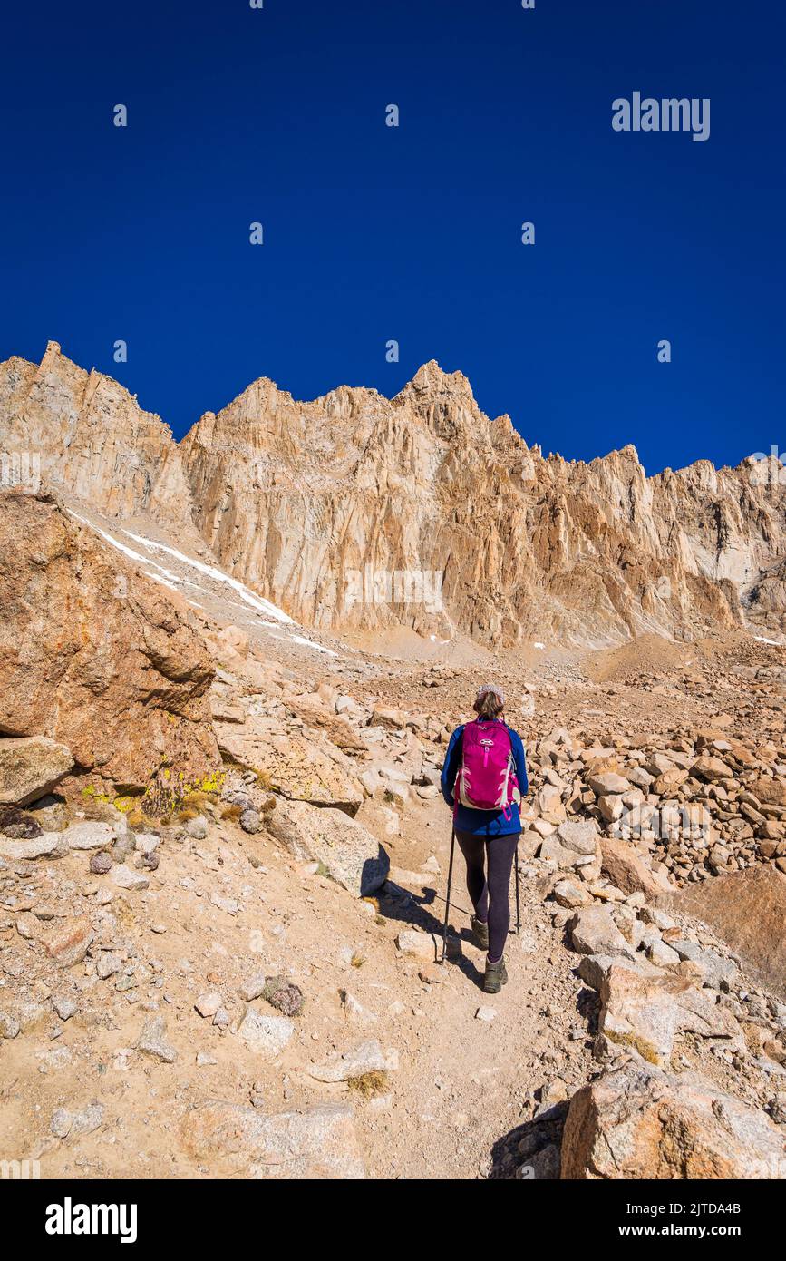 Hiker on the Mount Whitney Trail under Mount Muir, John Muir Wilderness ...