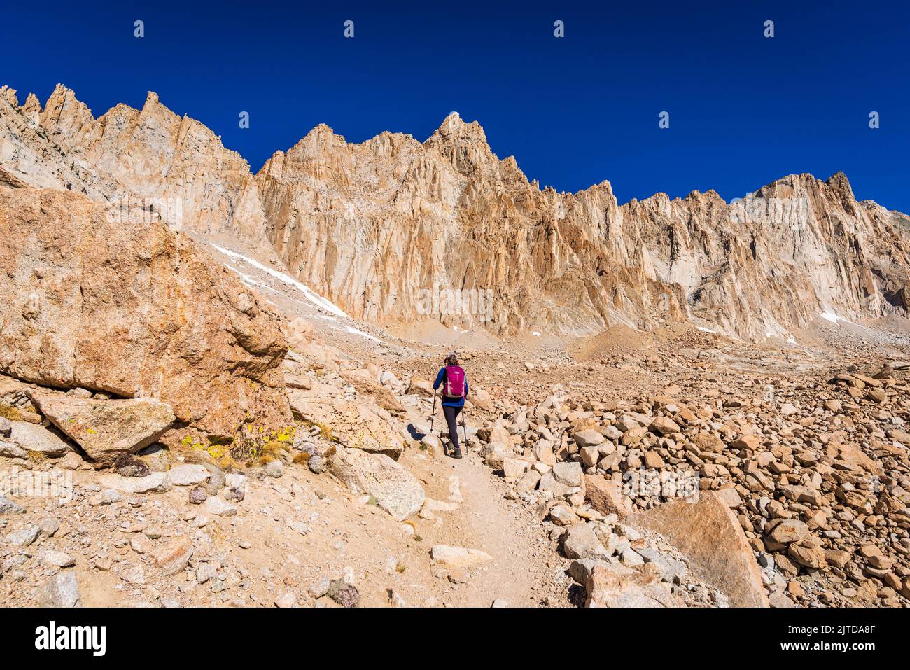 Hiker on the Mount Whitney Trail under Mount Muir, John Muir Wilderness ...