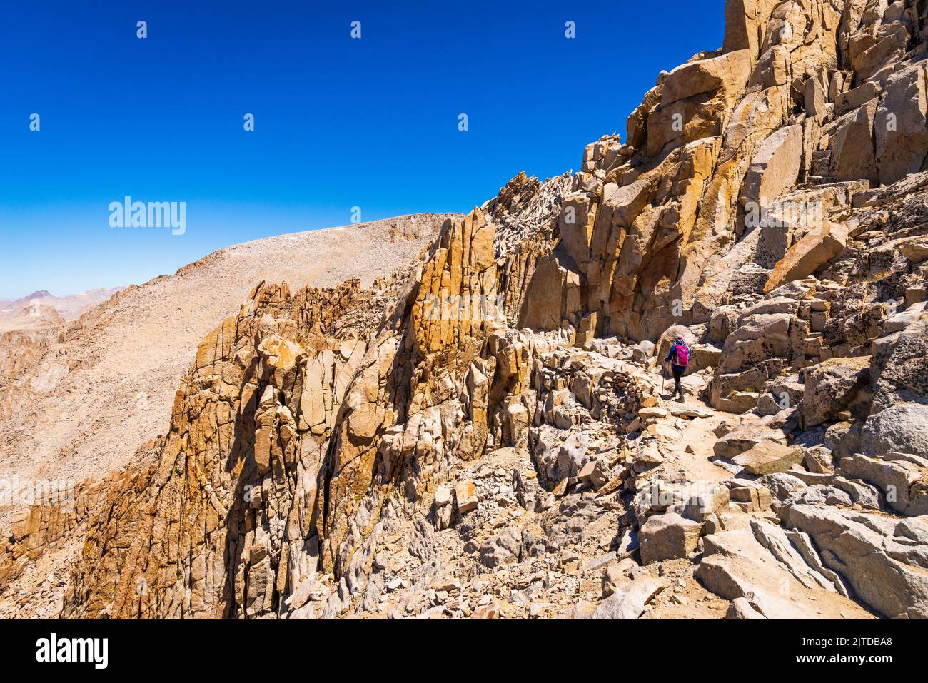 Hiker on the Mount Whitney Trail (summit hut visible), Sequoia National ...