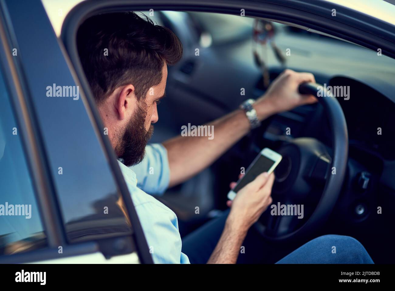 This looks easy enough to find. a unrecognizable man using his phone ...