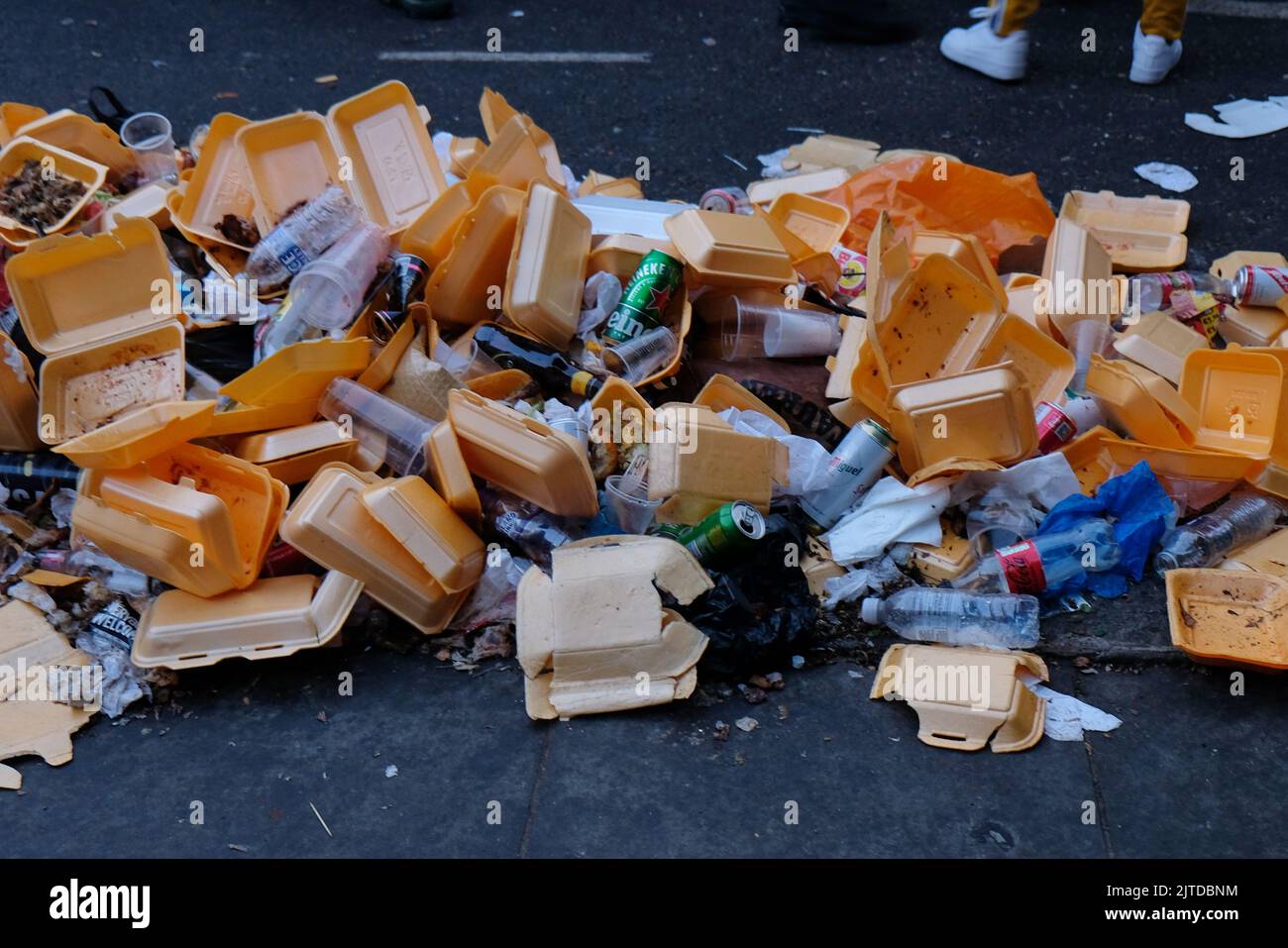 London, UK, 29th August, 2022. Discarded takeaway boxes lie on the road ...