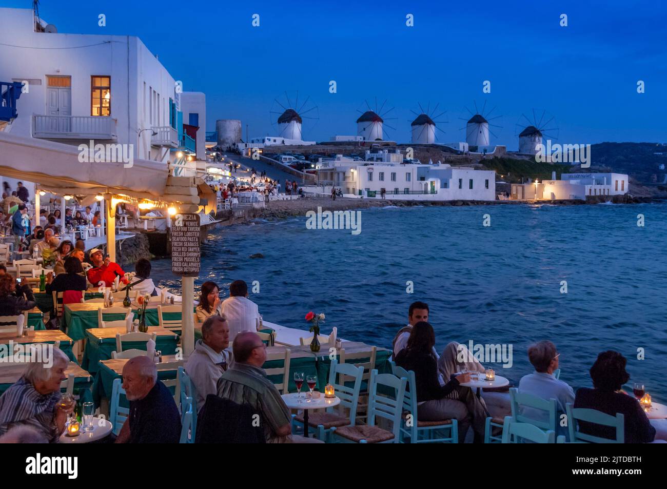 The windmills of Hora overlook the restaurants and bars of Little ...