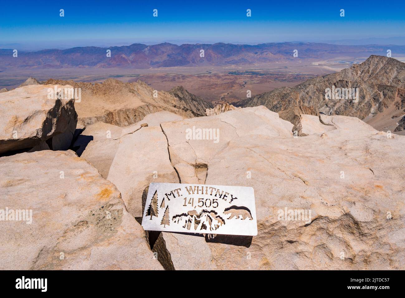 The summit plaque and Owens Valley from the summit of Mount Whitney ...