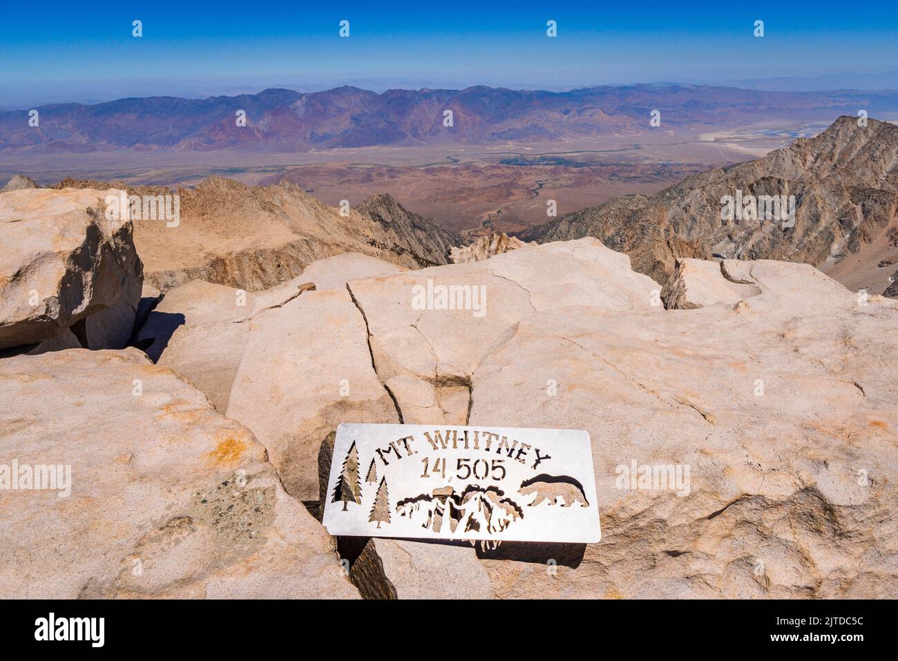 The summit plaque and Owens Valley from the summit of Mount Whitney ...
